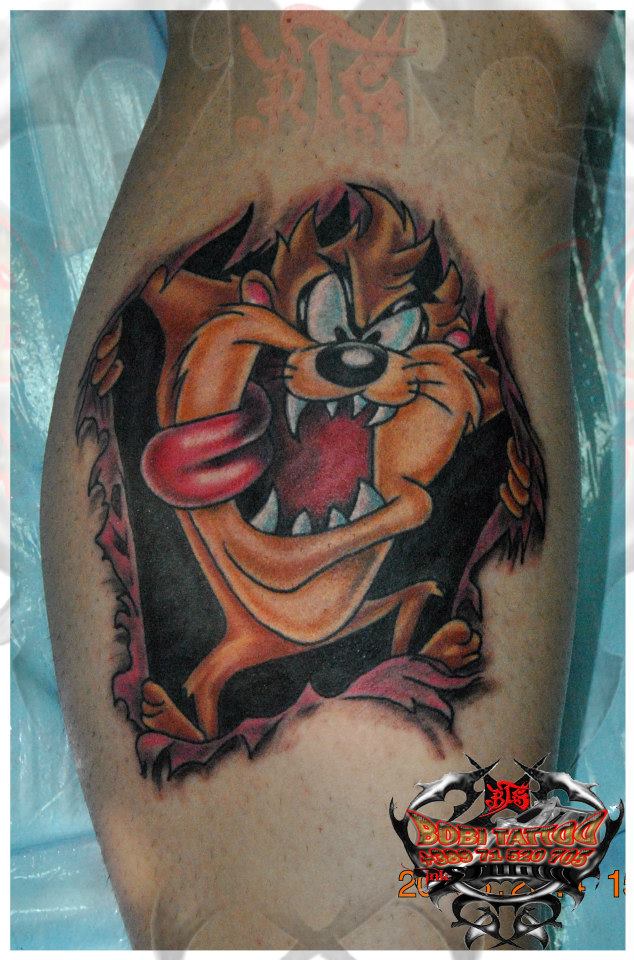 Taz Ripping Tattoos