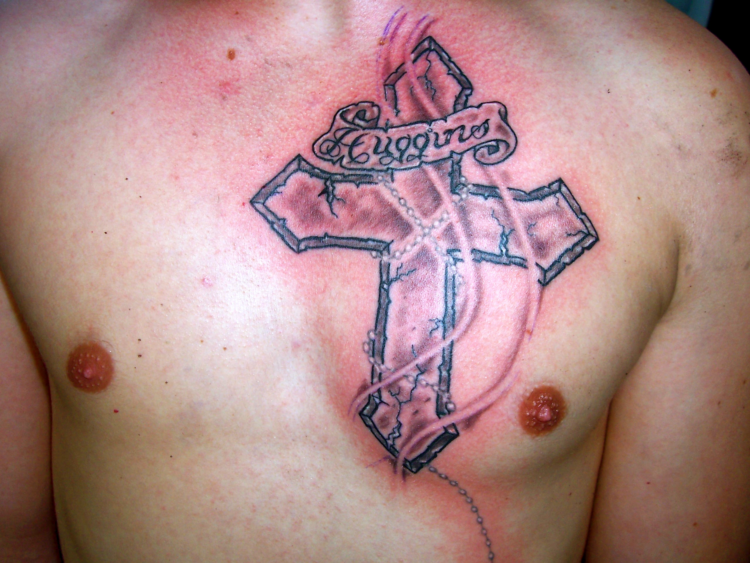 Cross Tattoo On Left Chest